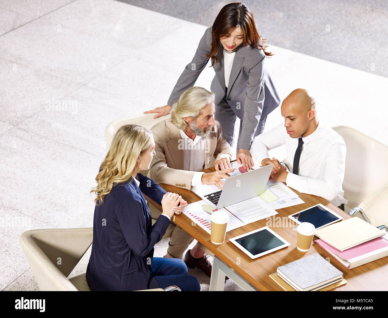 multinational and multiethnic corporate executives meeting in office ...