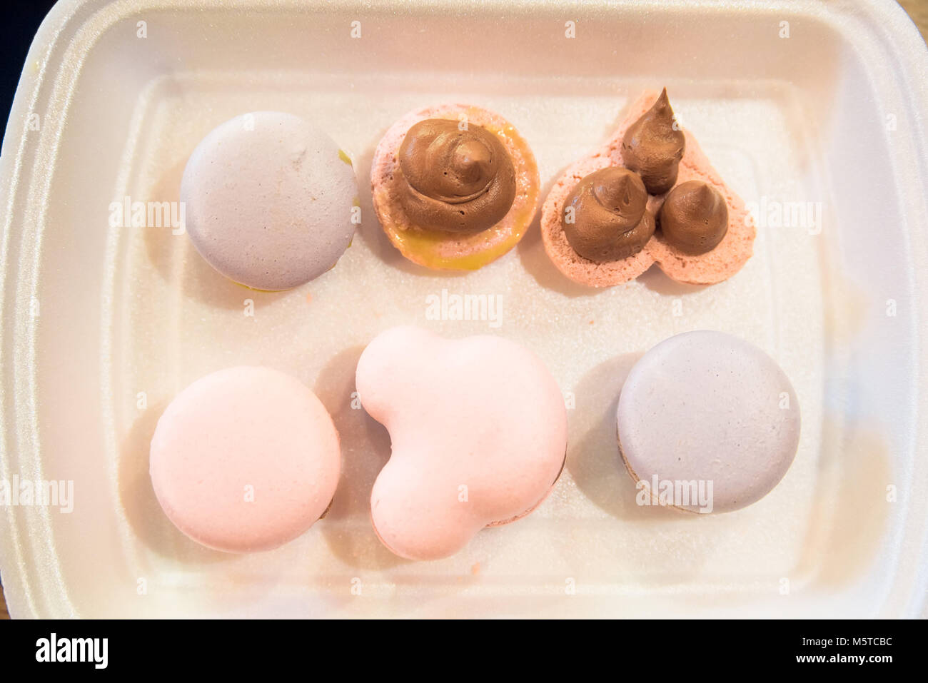 Several macarons in food container Stock Photo - Alamy