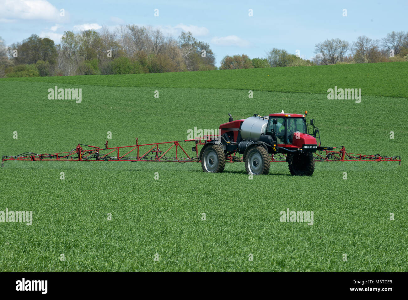 Tractor with agricultural sprayer machine for pesticide spraying Stock ...