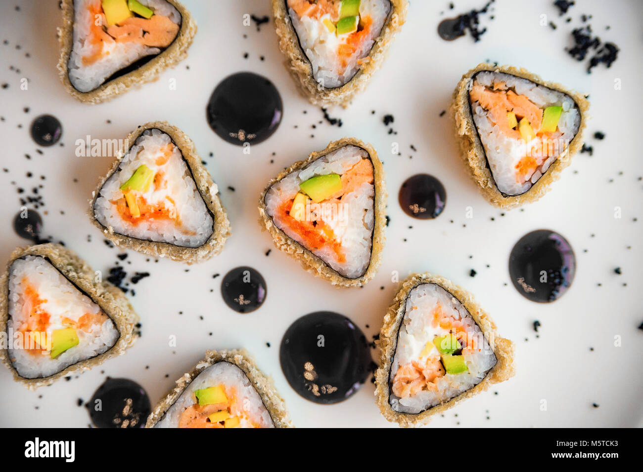 Top view delicious triangle sushi rolls on plate Stock Photo - Alamy