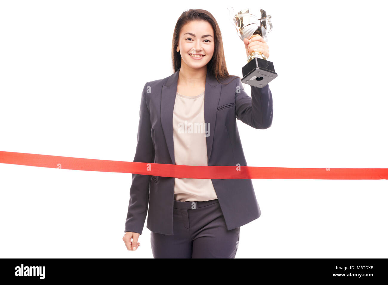 Businesswoman crossing finishing line hi-res stock photography and ...