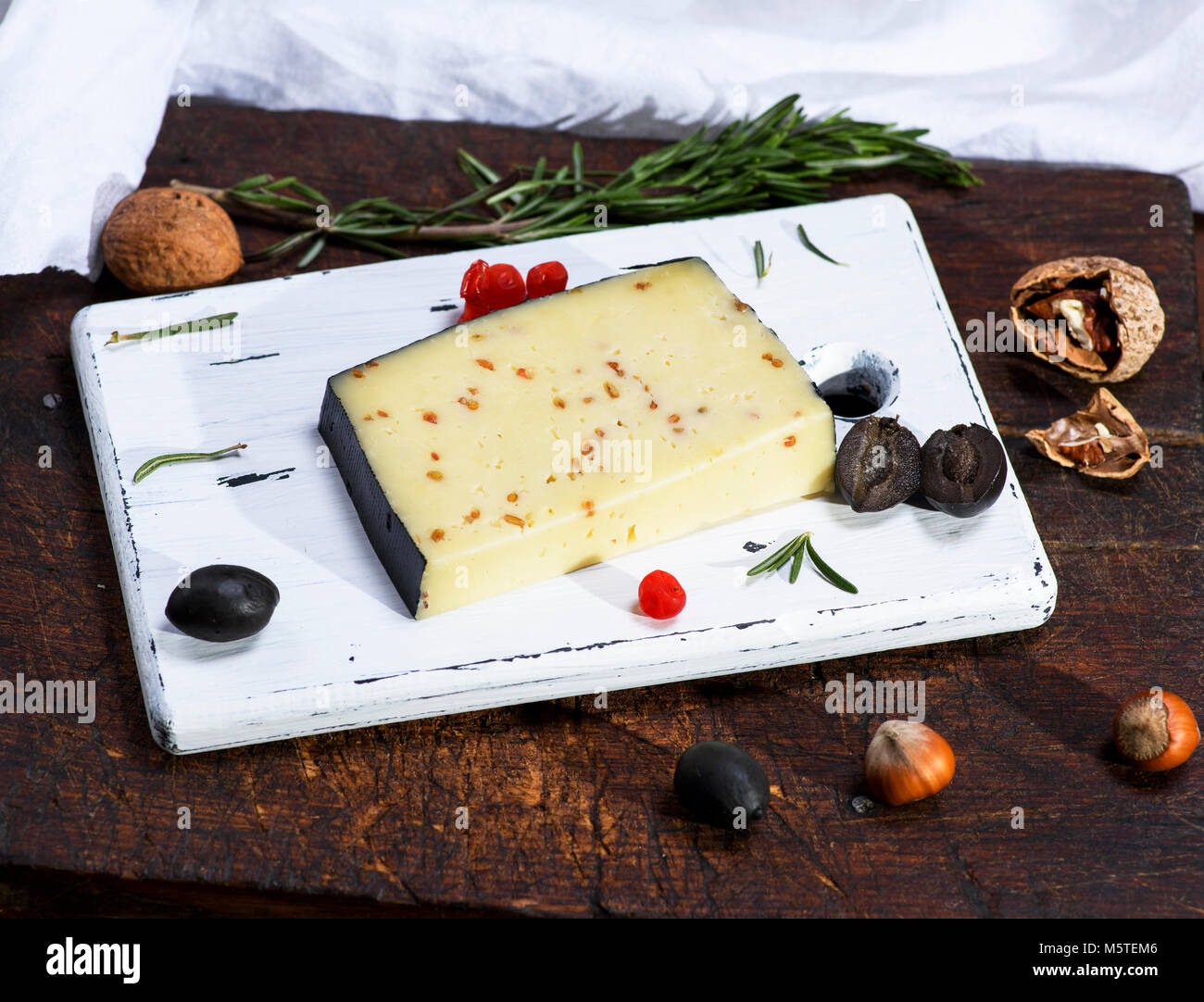 cheese with walnuts on a white wooden board, top view Stock Photo - Alamy