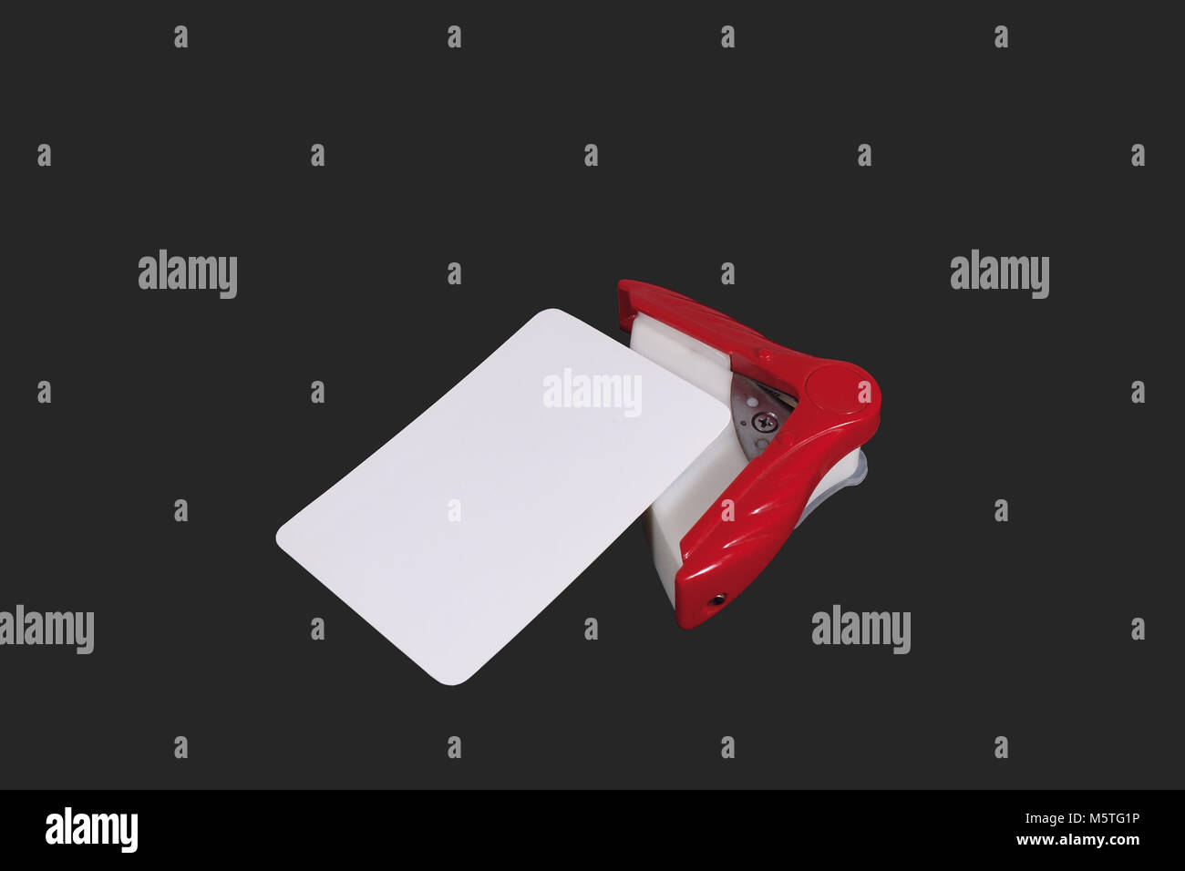 Corner cutter rounder punch for card photo paper cutter. Isolated on a ...