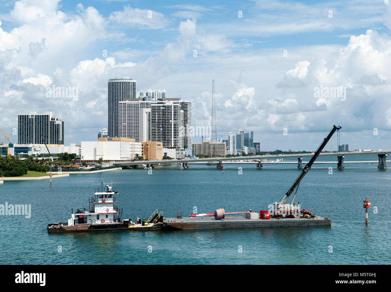 The view of a platform with a crane and Miami skyscrapers in a ...