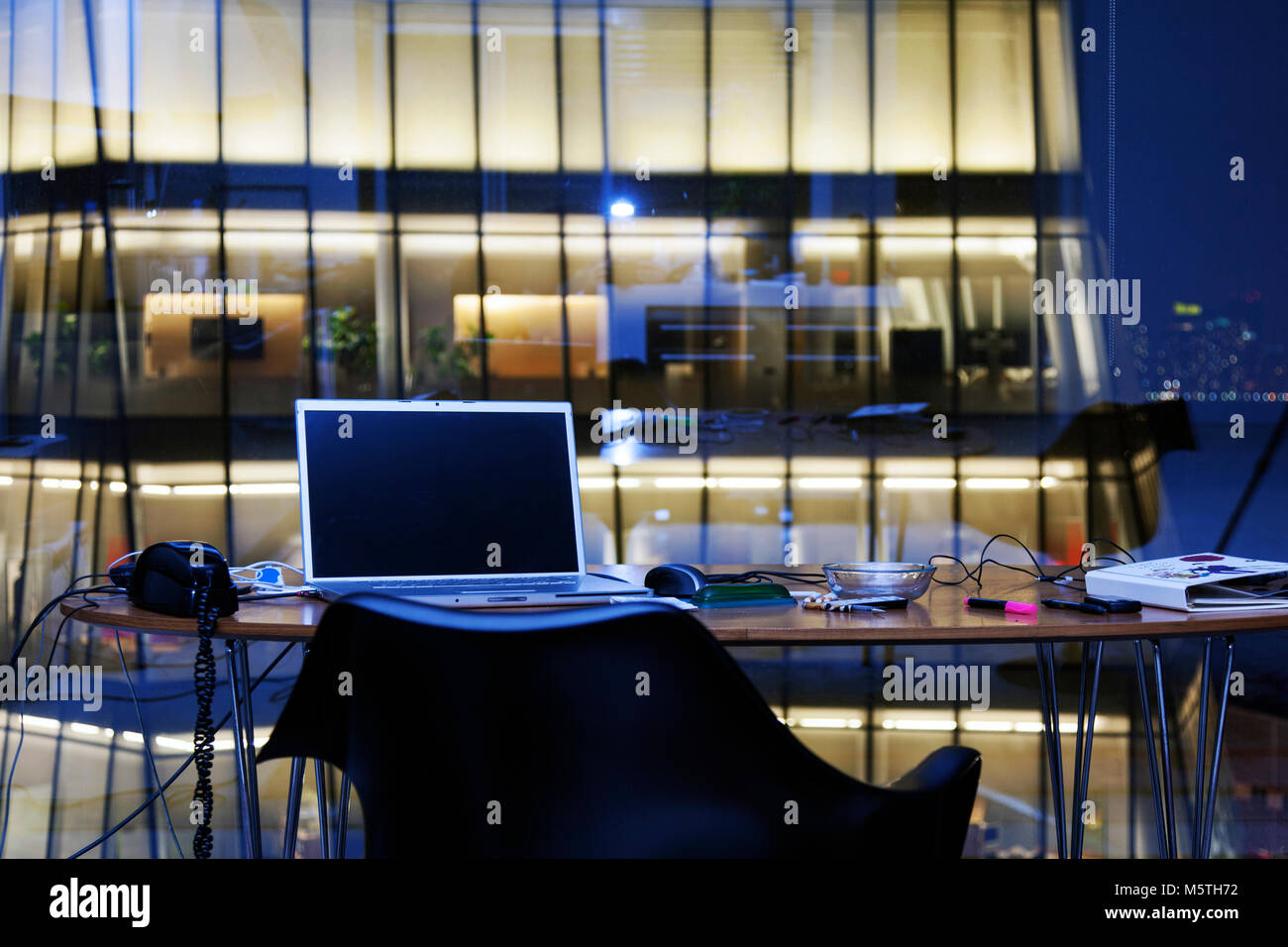 An office with a city view at night time in NYC Stock Photo - Alamy