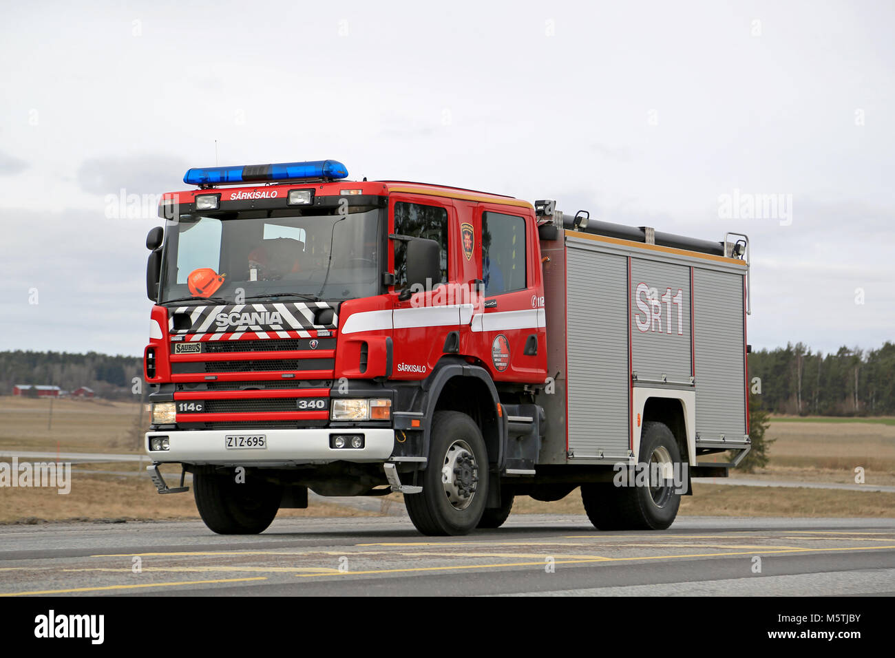 SALO, FINLAND - MARCH 22, 2015: Scania 114C 340 Fire truck moves along ...