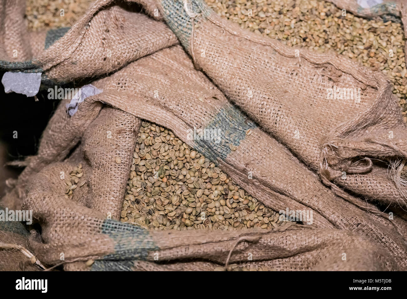 Bags with raw coffee beans hi-res stock photography and images - Alamy