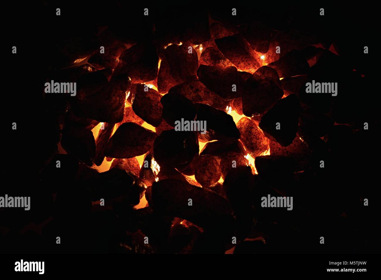 Representation of embers and fire with the help of light and stones ...