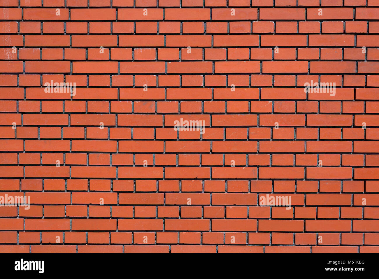 wall of bricks - red clinker brick in natural light Stock Photo - Alamy
