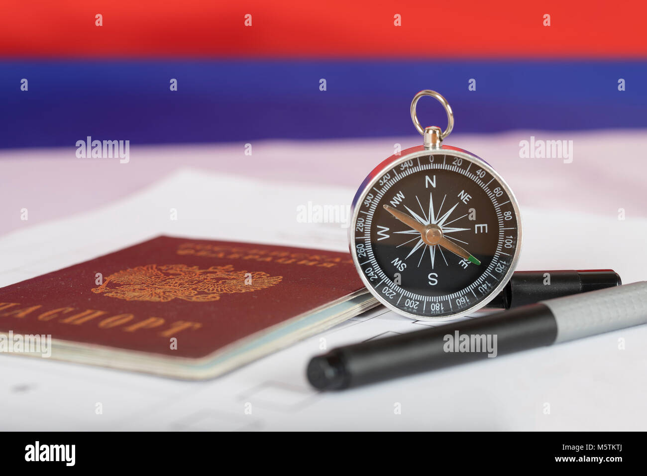 Magnetic compass, Russian pass and black pen on ballot paper. Russian ...