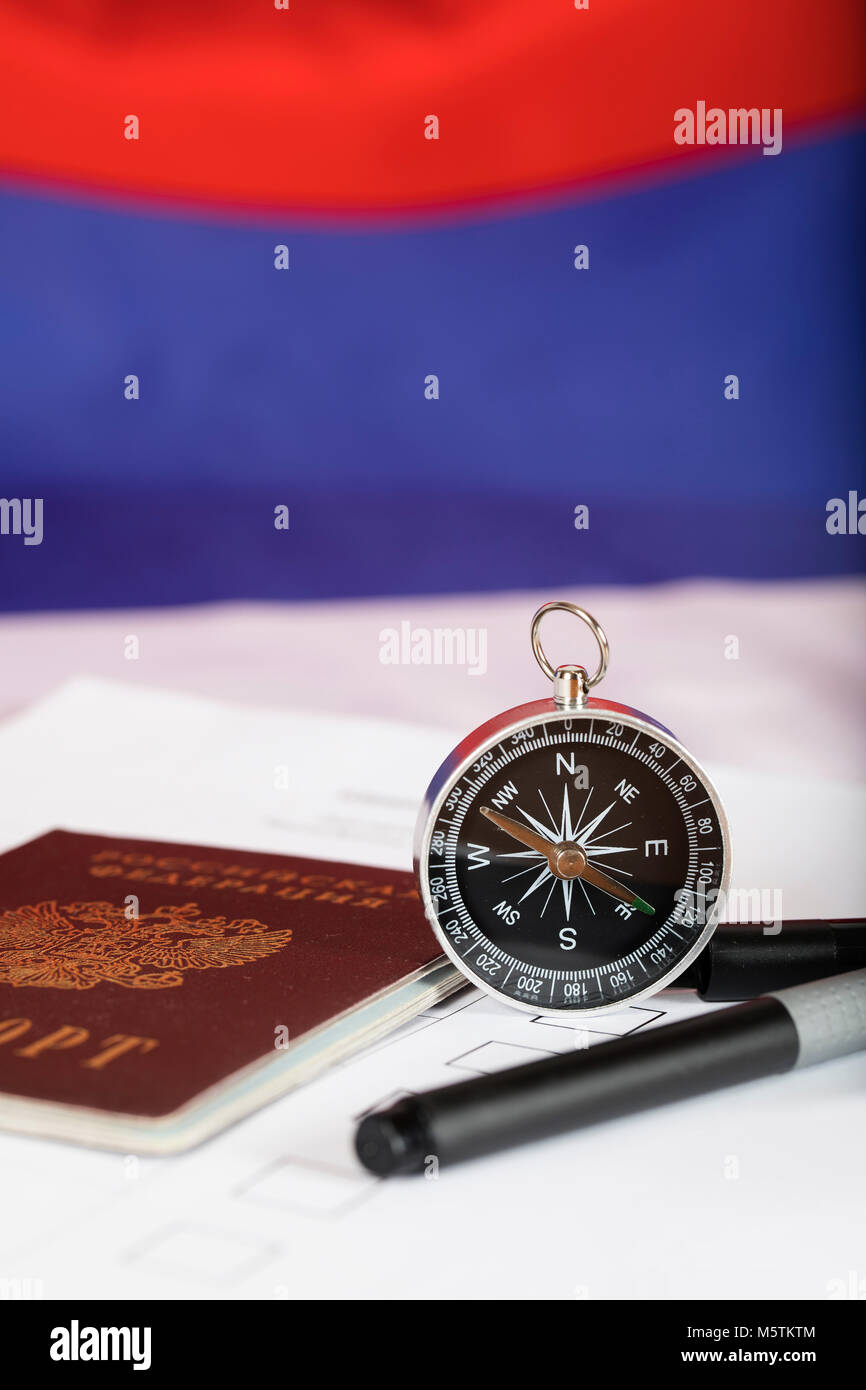 Magnetic compass, Russian pass and black pen on ballot paper. Russian ...