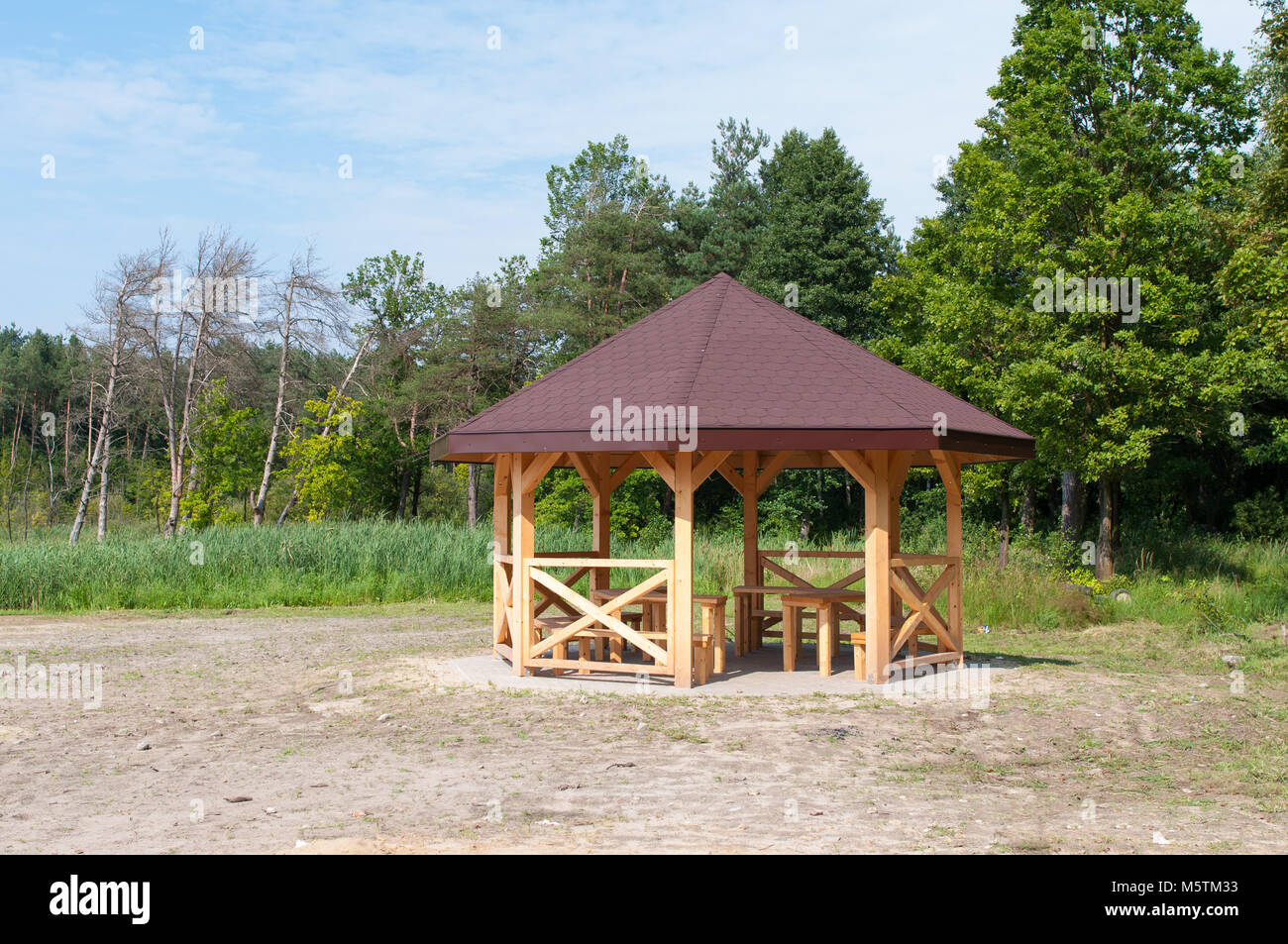 wooden gazebo outside in the forest background Stock Photo - Alamy