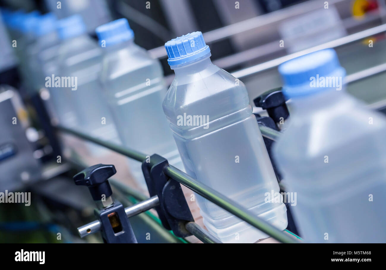 Saline bottle filling in pharmaceutical manufacturing. Saline bottle ...