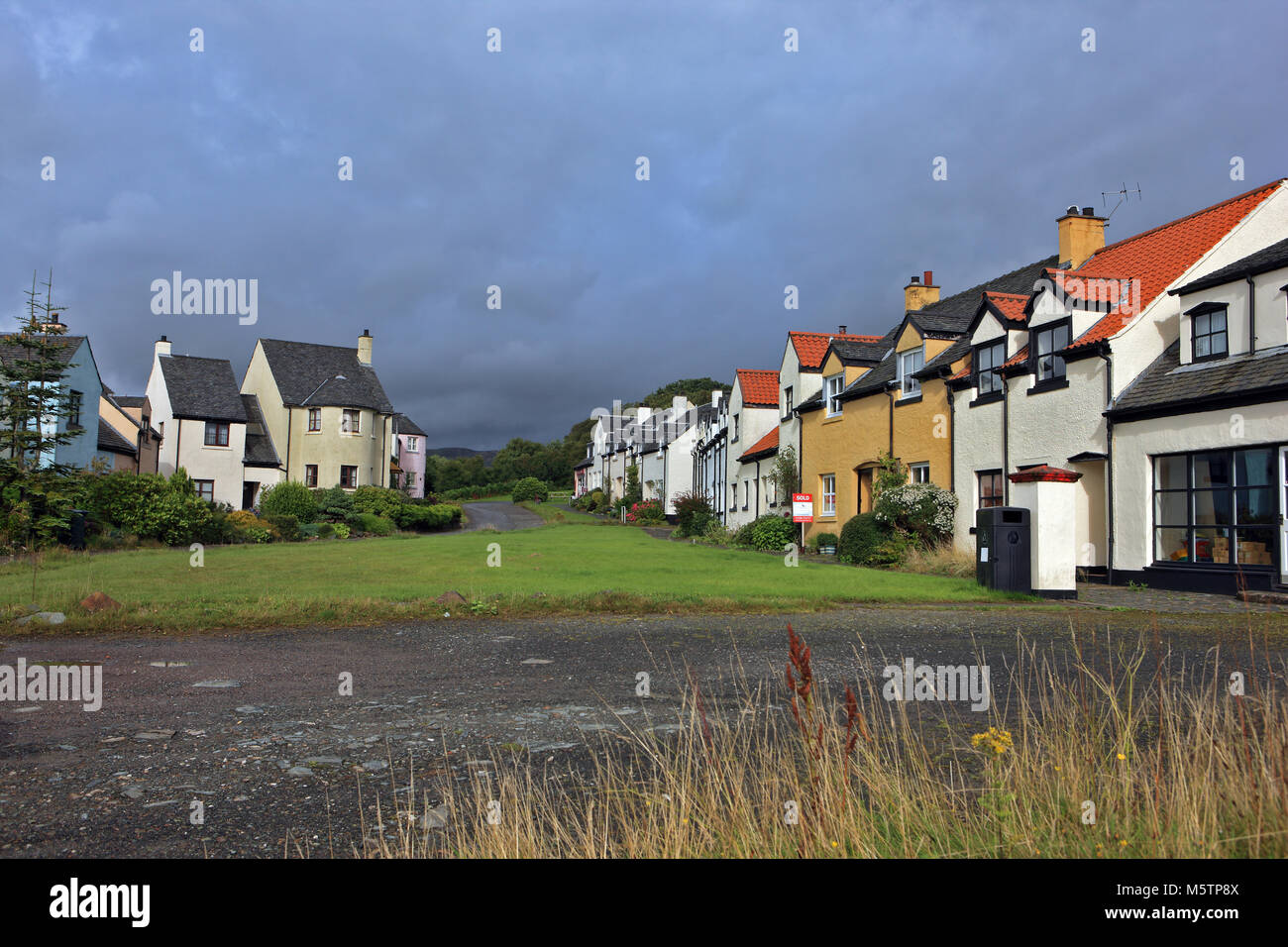 Colourful houses at Craobh Haven holiday resort village and marina ...