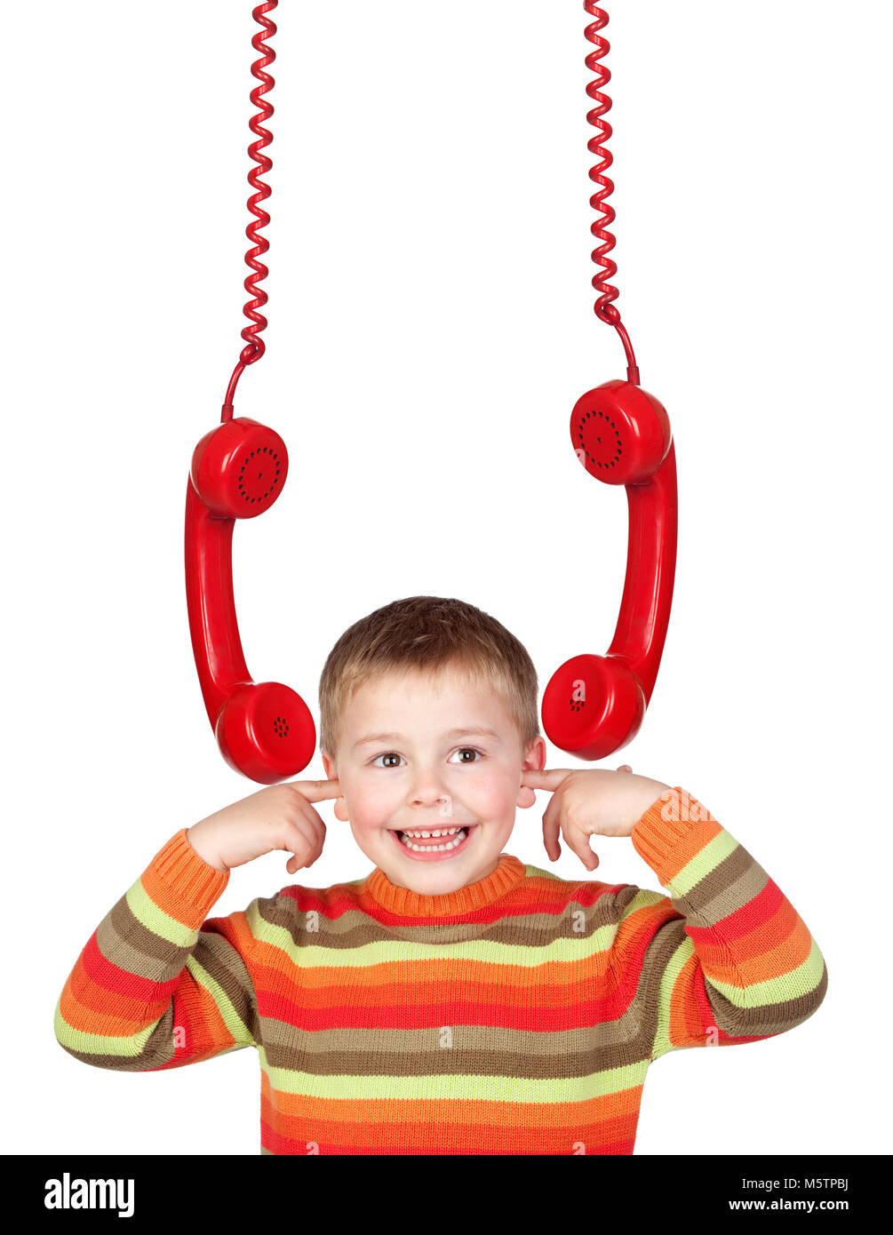 Funny little child talking two phones isolated on a white background ...