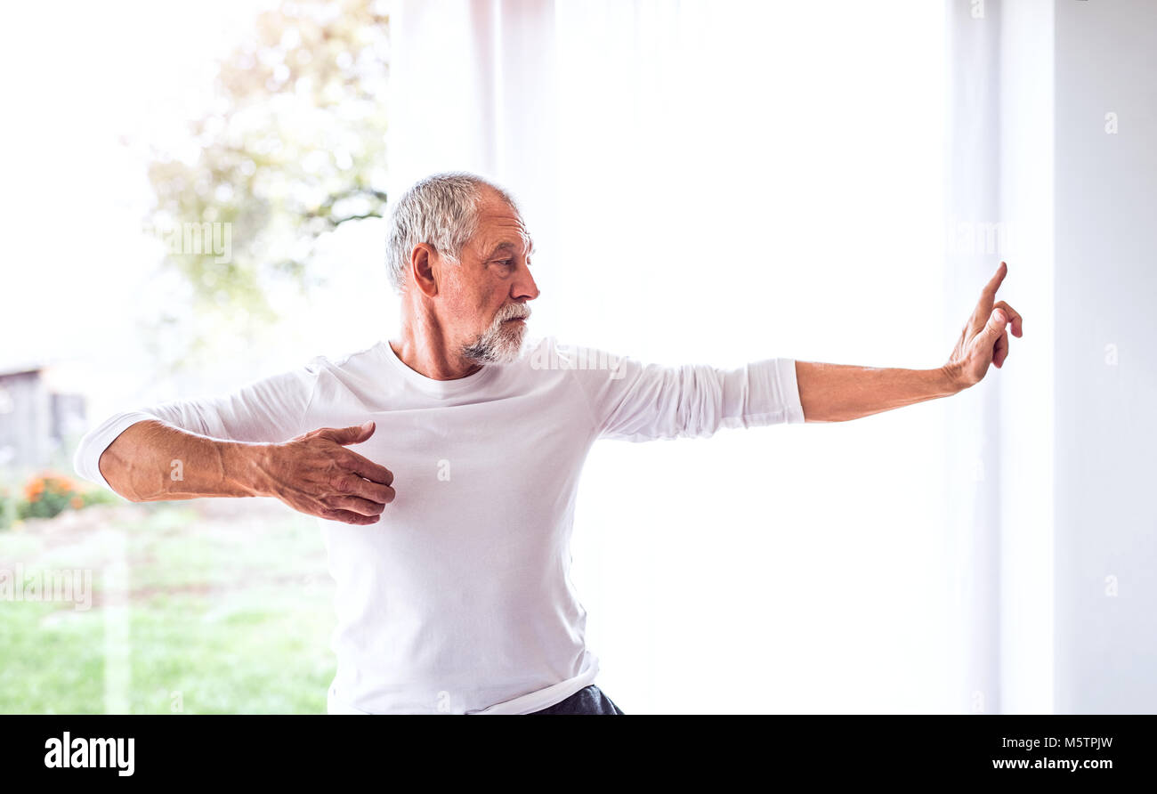 Senior man doing exercise at home Stock Photo - Alamy
