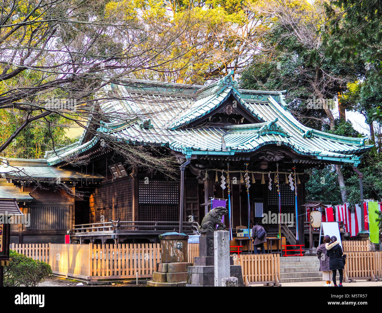 People visiting small old Shinto shine in Tokyo, Japan to pray Stock ...