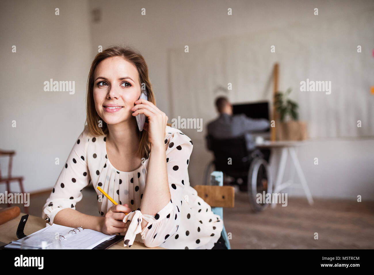 Woman making personal call in office hi-res stock photography and ...