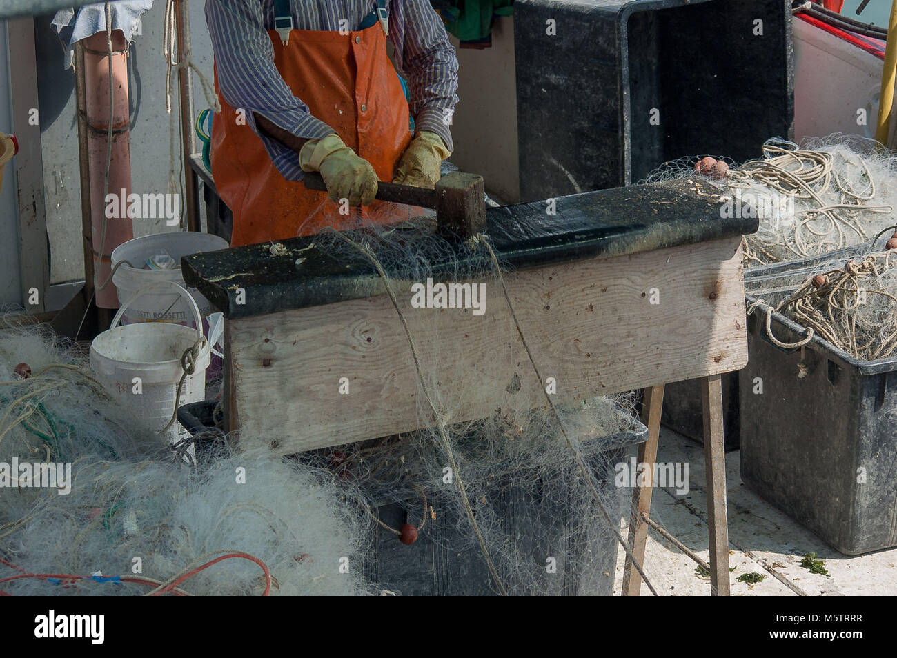 cleaning of fishing nets Stock Photo - Alamy