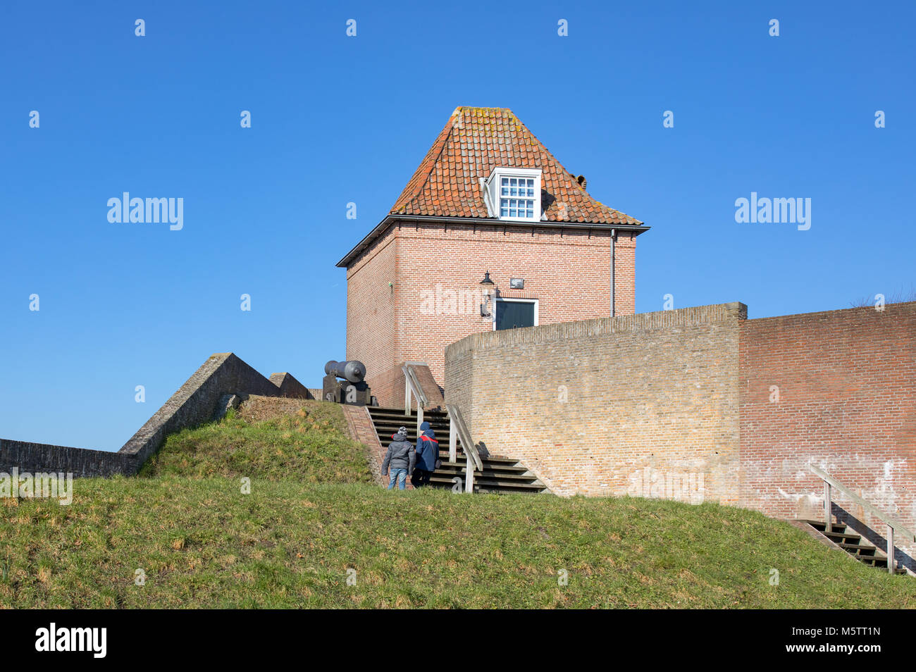 Old, medieval fortifications and buildings on the embankment in Heusden ...