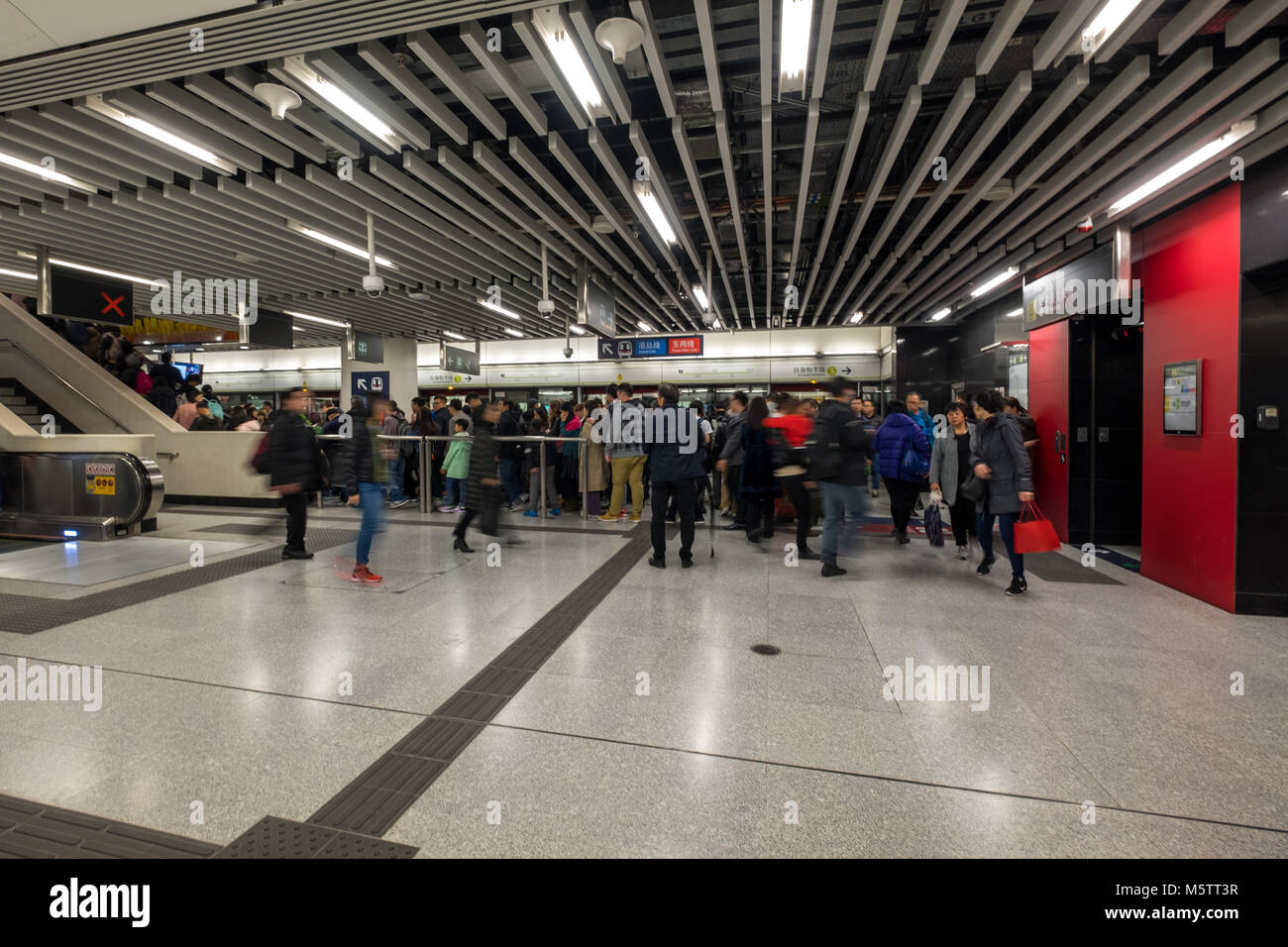 HONG KONG - February 21, 2018: Crowded people walking access to the ...