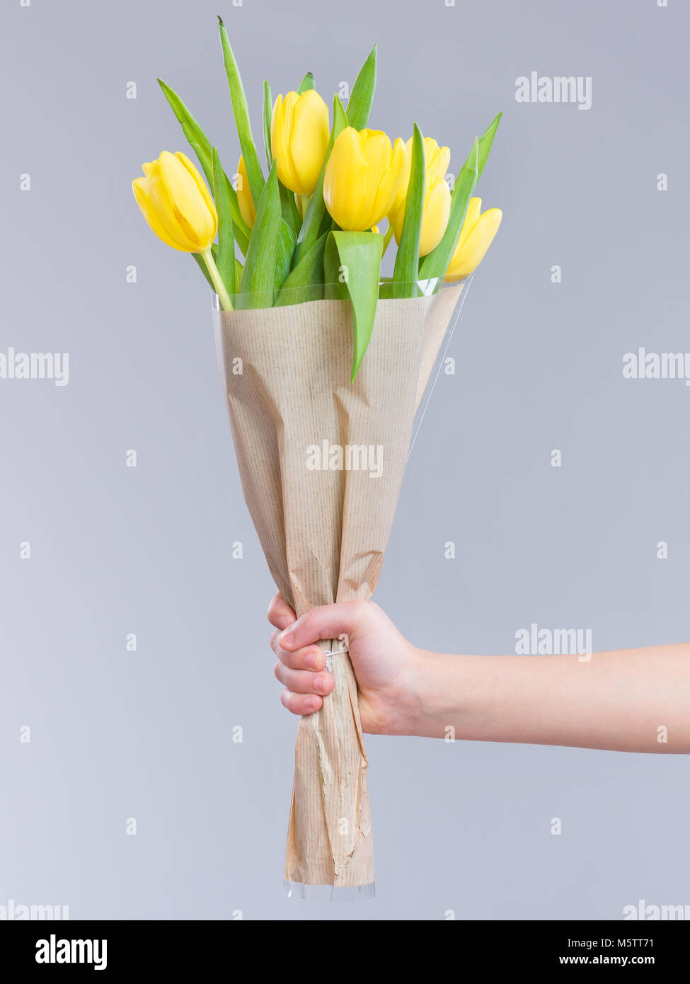 Hand with flowers Stock Photo - Alamy