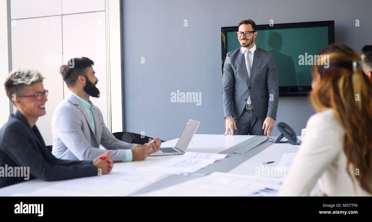 Perspective businesspeople having meeting in conference room Stock ...