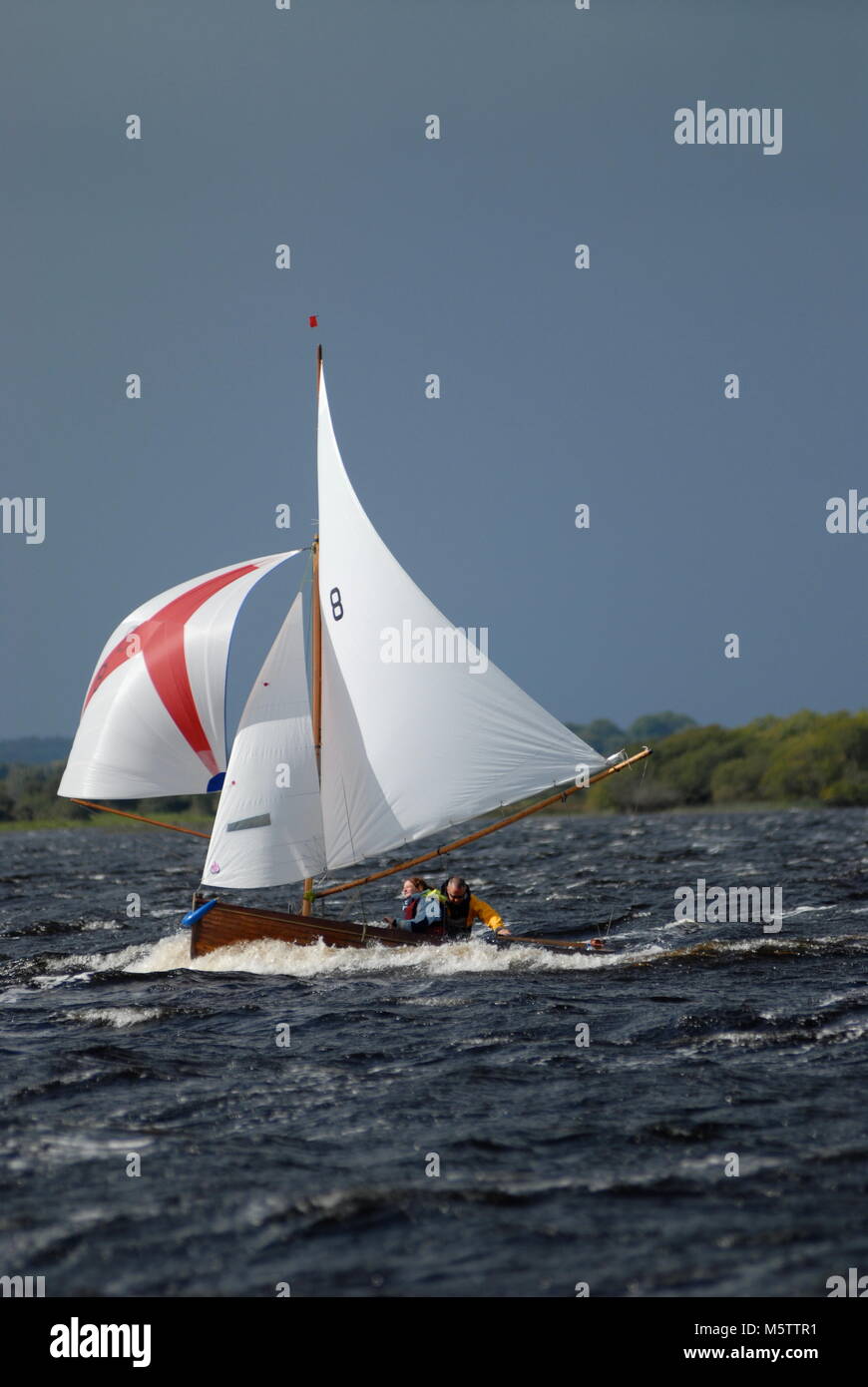 A traditional Water Wag dinghy races down Lough Ree during the Irish ...