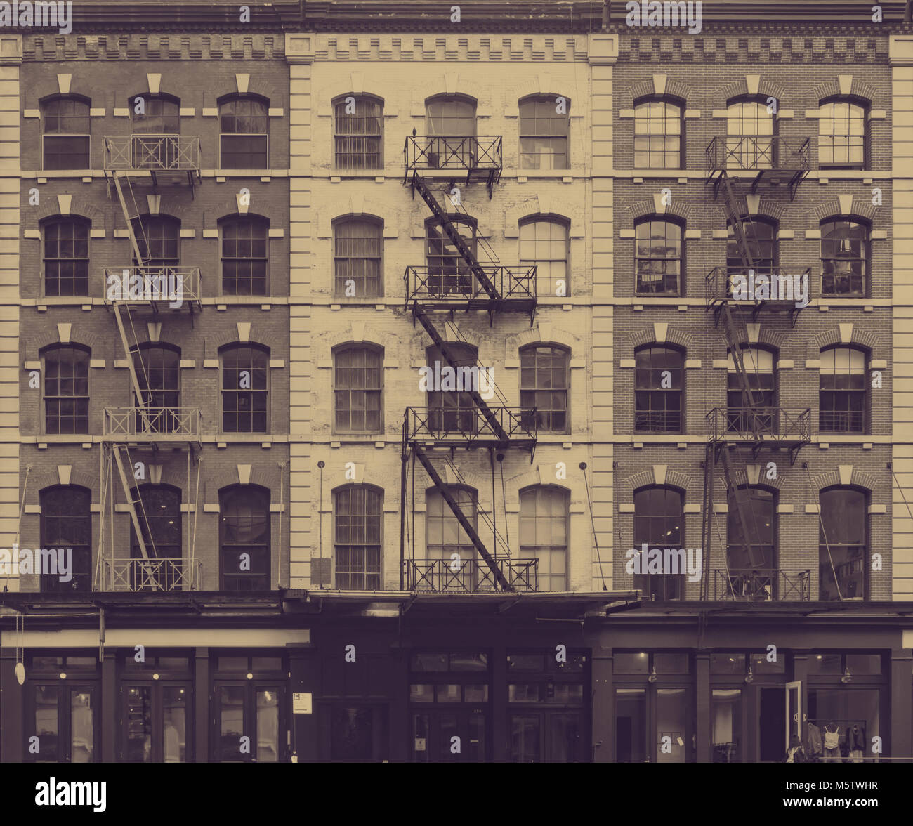 Old faded wall of windows on New York City buildings Stock Photo - Alamy