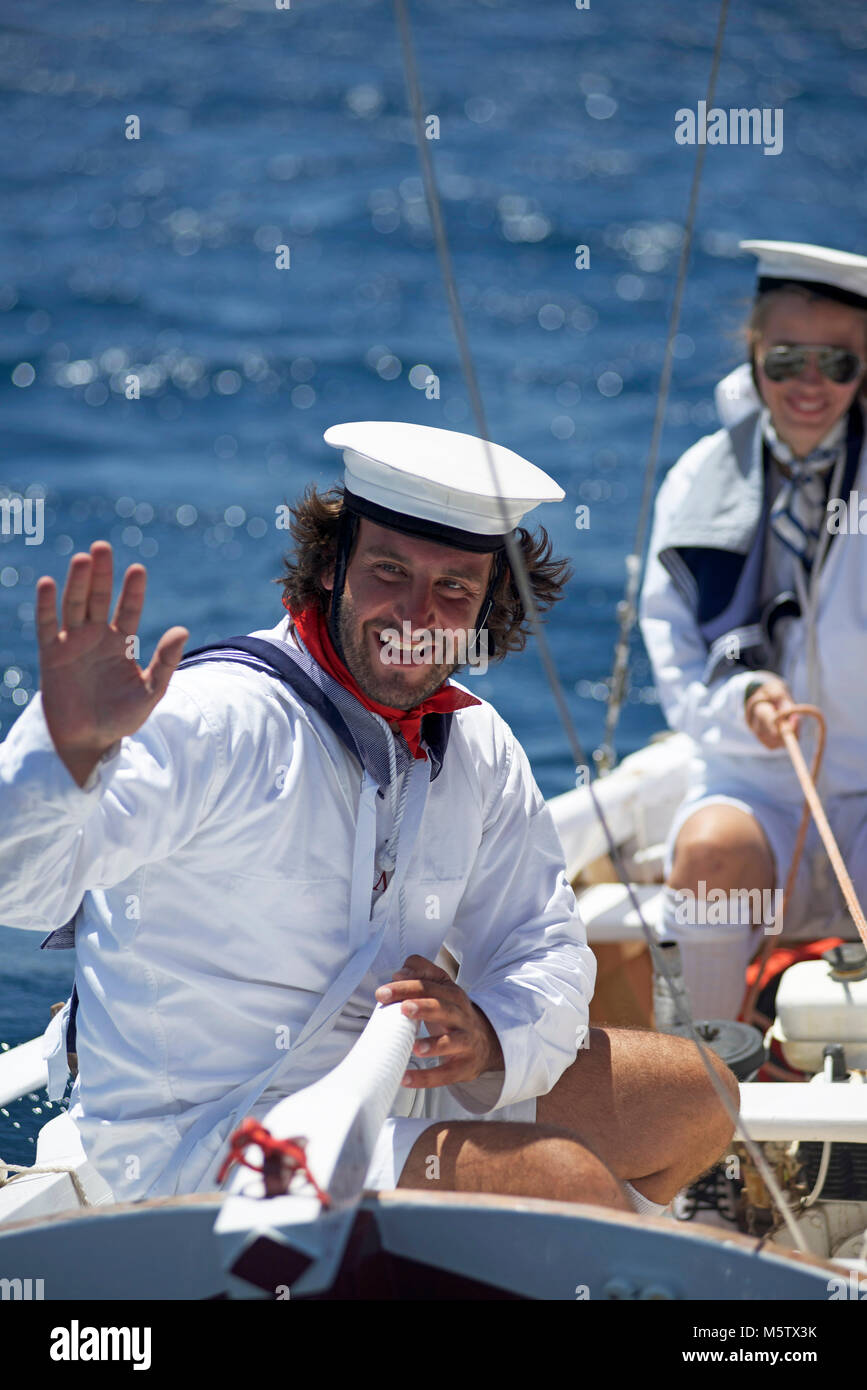 Owner Dimitris Stavrakopoulos and friend on board his boat Isabella M in Ermoupoli harbour on ...