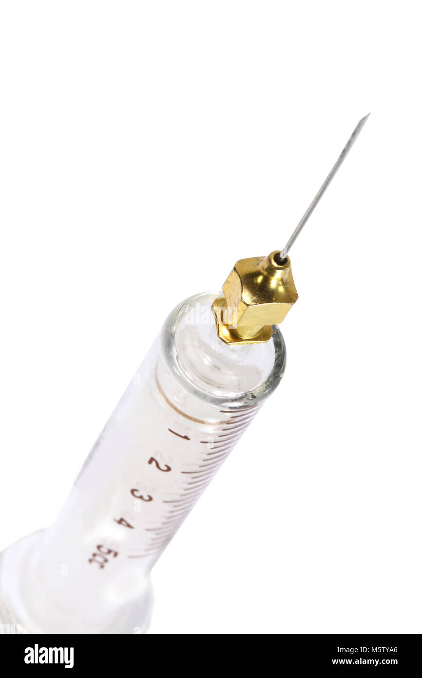 detail of the needle for injections of a glass medical syringe on a ...