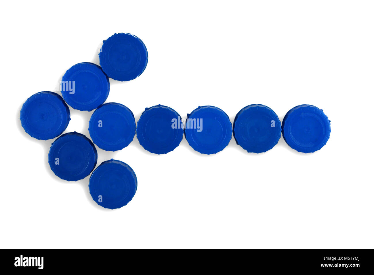 an arrow formed by blue plastic plugs on white background Stock Photo ...