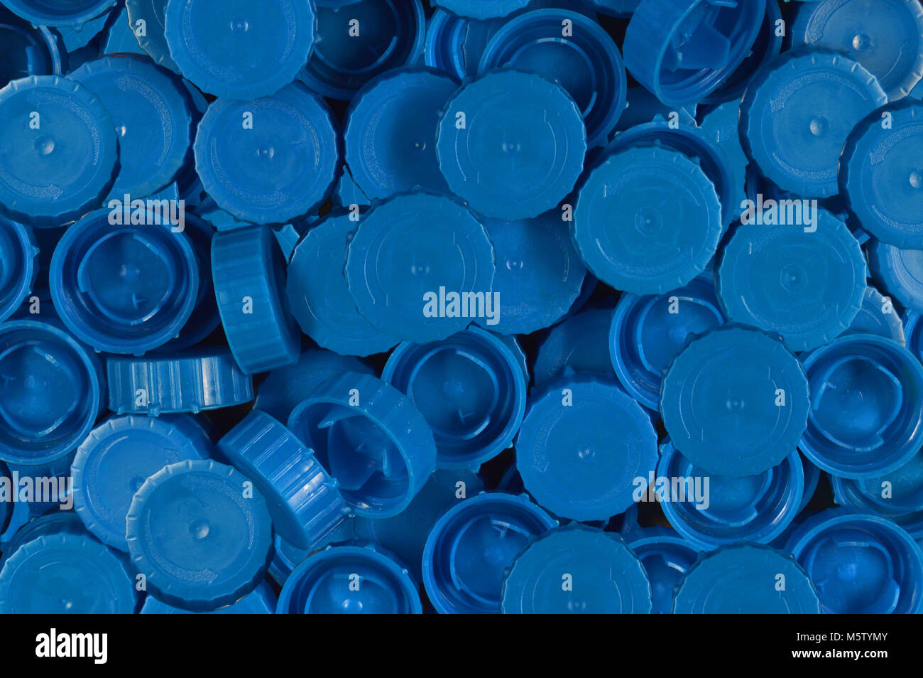 background with blue plastic plugs Stock Photo - Alamy