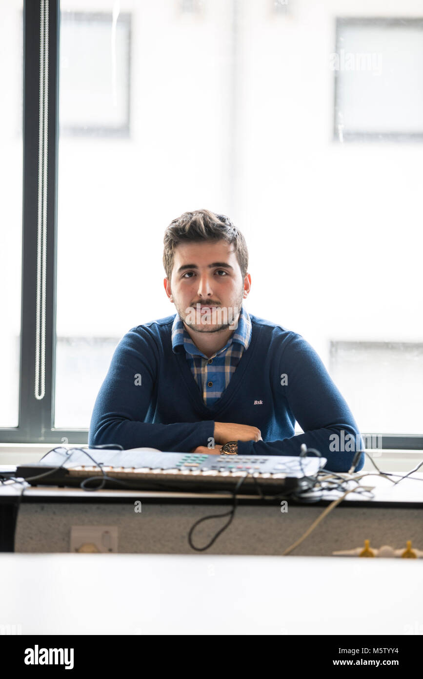 a young middle eastern science student is photographed in the physics ...