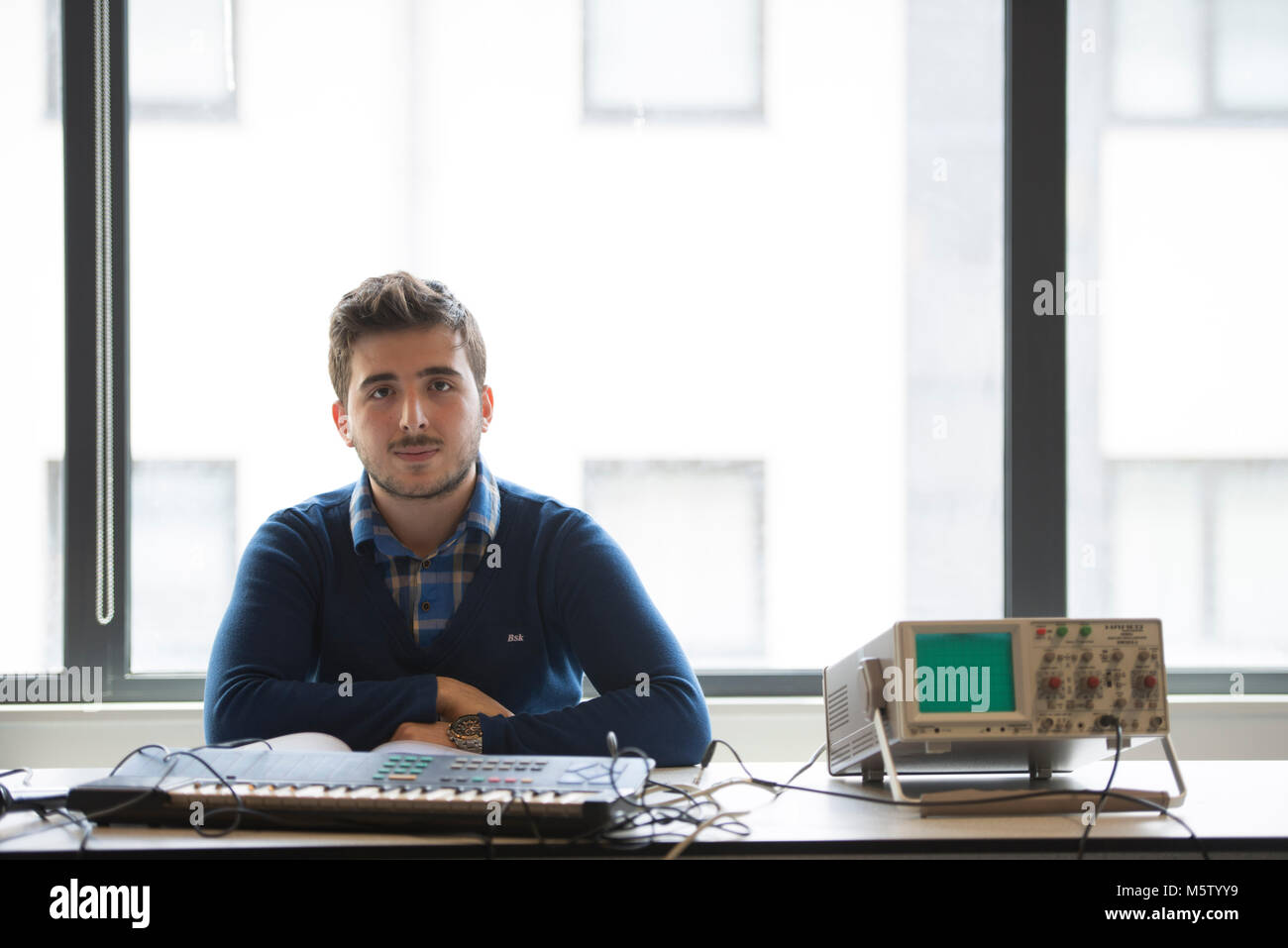 a young middle eastern science student is photographed in the physics ...