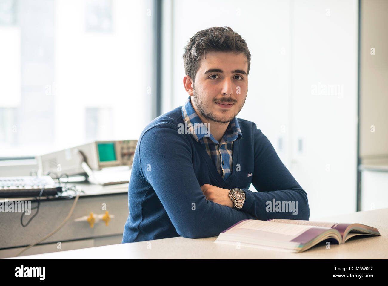a young middle eastern science student is photographed in the physics ...