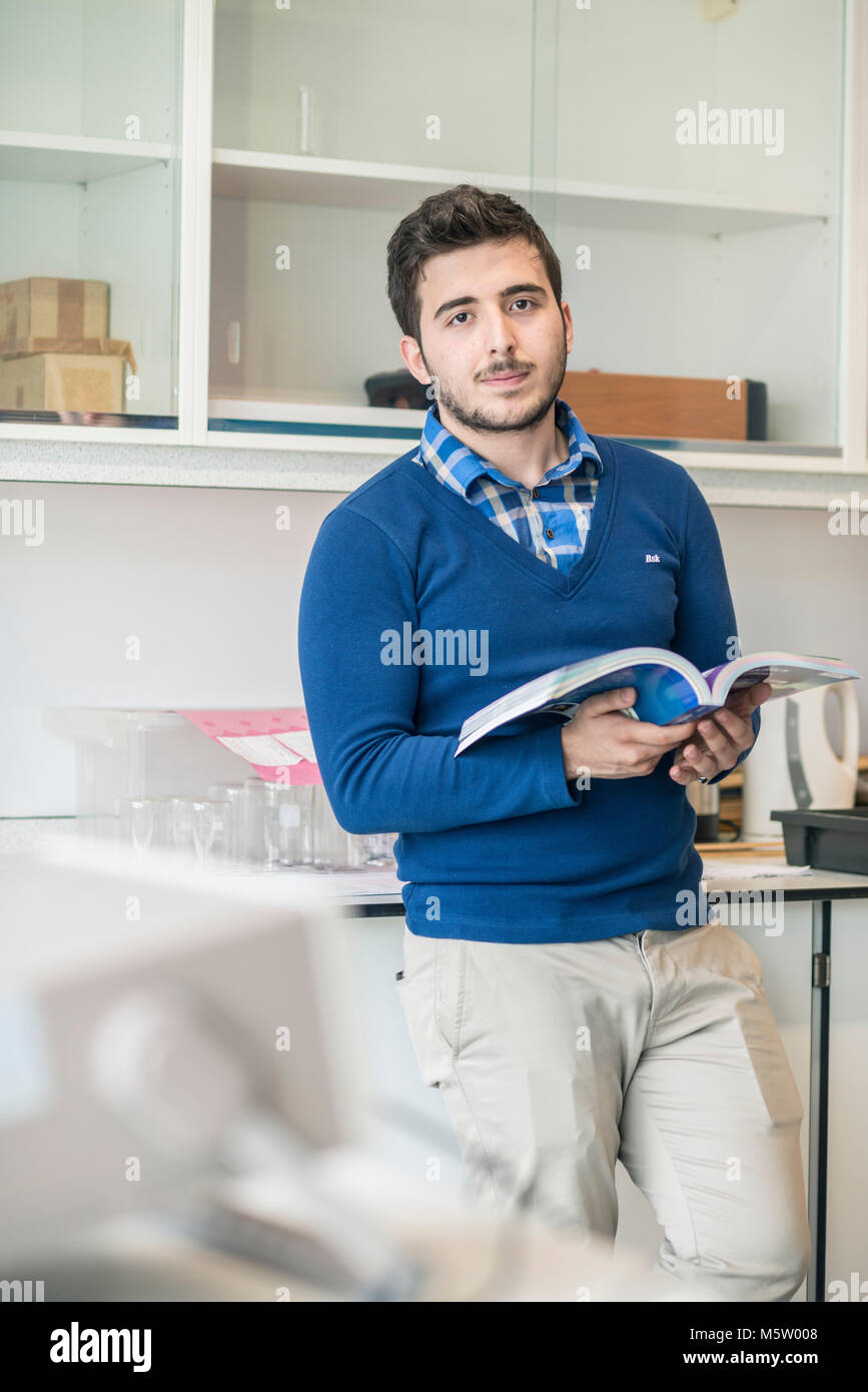 a young middle eastern science student is photographed in the physics ...
