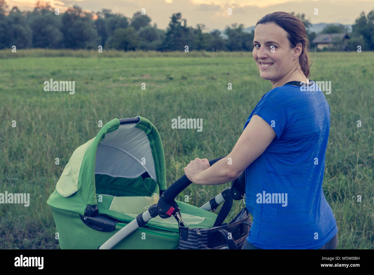 Mom pushing a stroller hi-res stock photography and images - Alamy