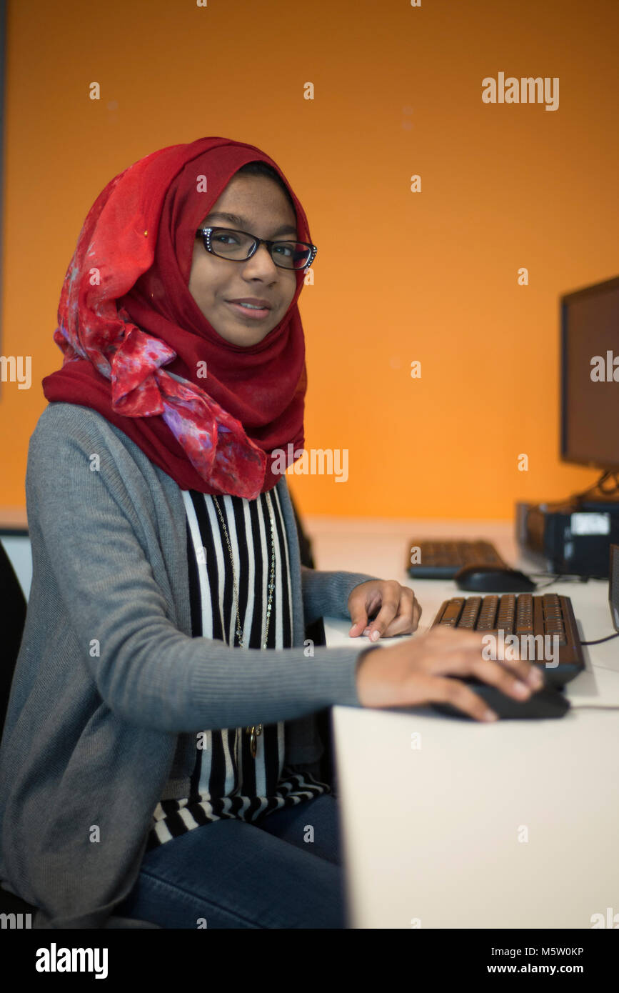 a young international muslim female student poses for a photo in the ...