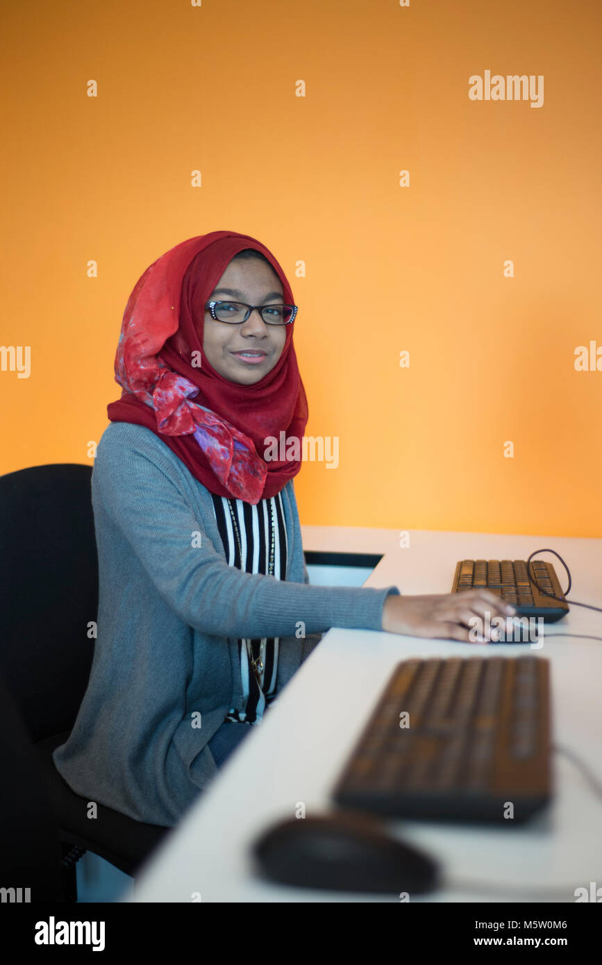a young international muslim female student poses for a photo in the ...