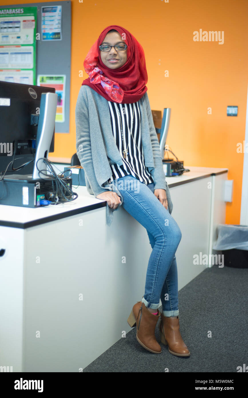 a young international muslim female student poses for a photo in the ...