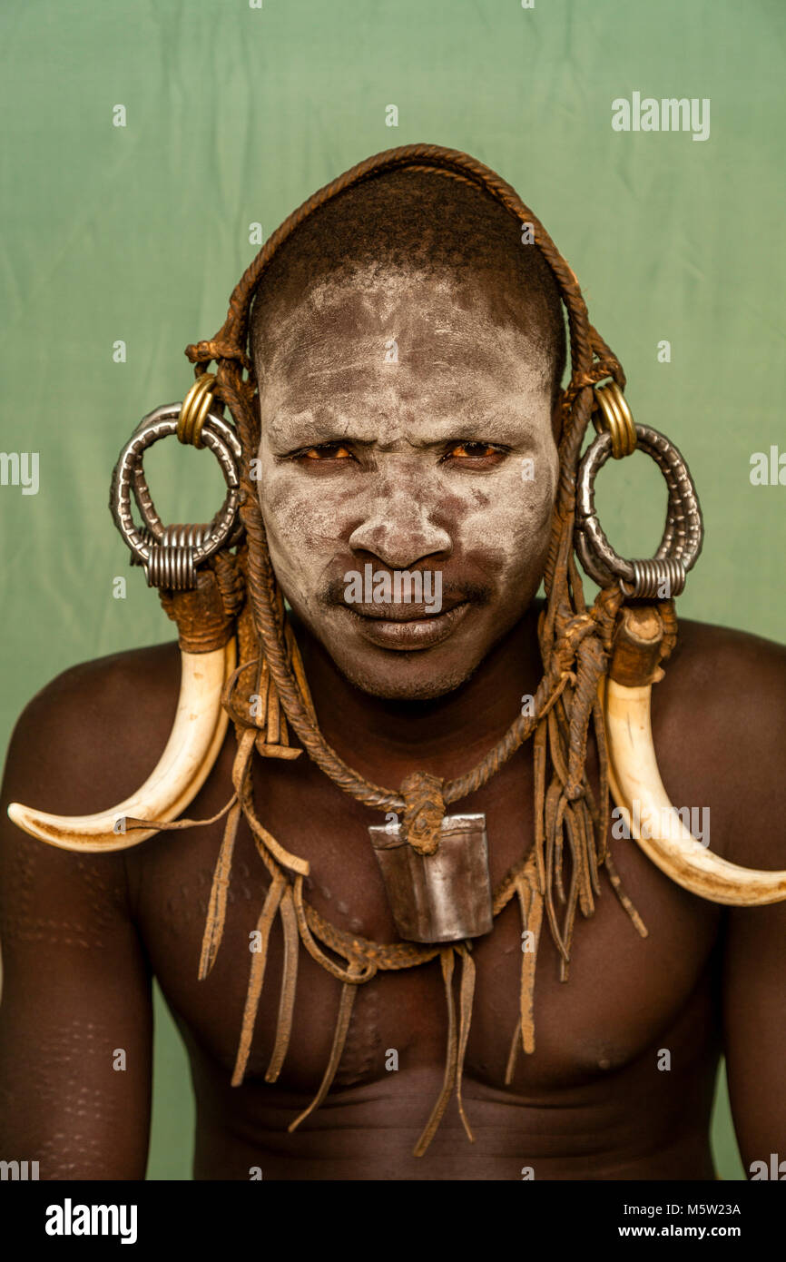 A Portrait Of A Young Man From The Mursi Tribe, Mursi Village, Omo ...