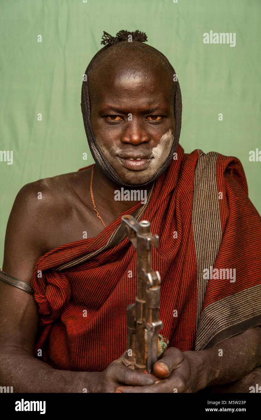 A Portrait Of A Young Man From The Mursi Tribe, Mursi Village, Omo ...