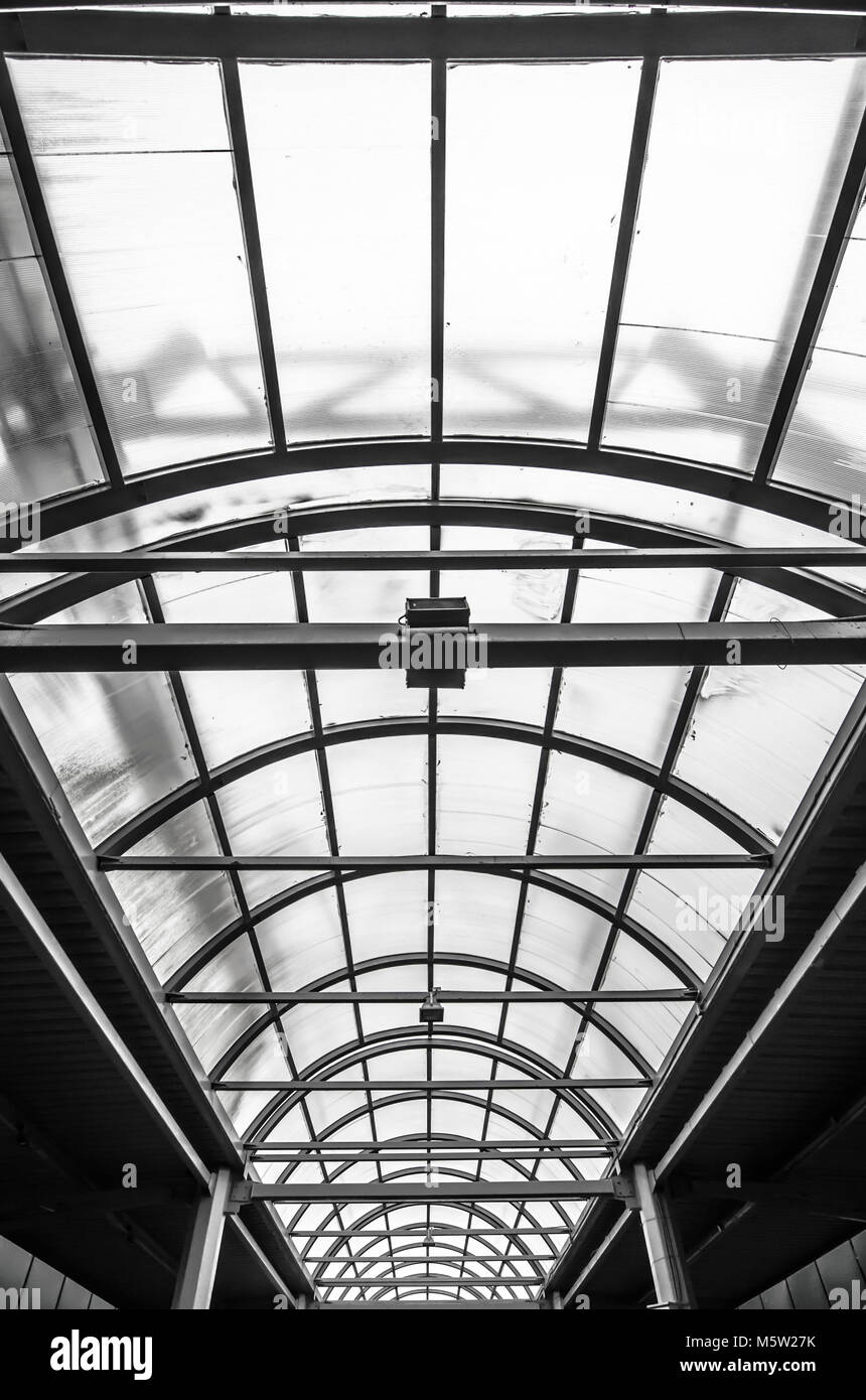 Semicircular glass transparent roof on a metal frame as a background or ...