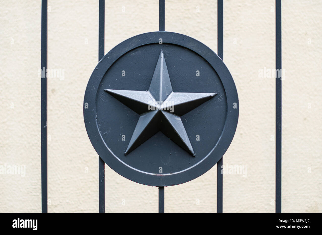Gray metal star army military on metal fence gate Stock Photo - Alamy