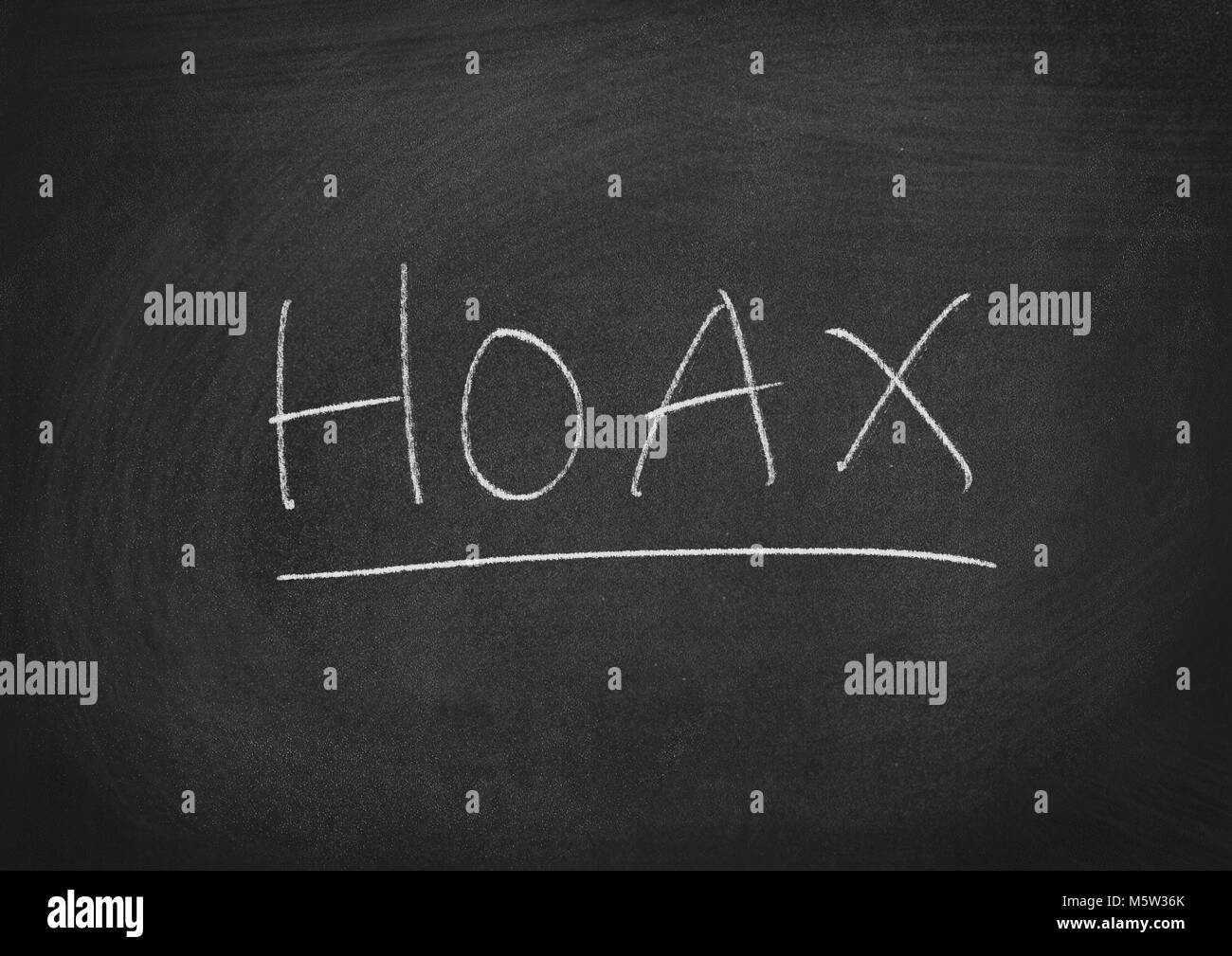hoax conept word on a chalkboard background Stock Photo - Alamy