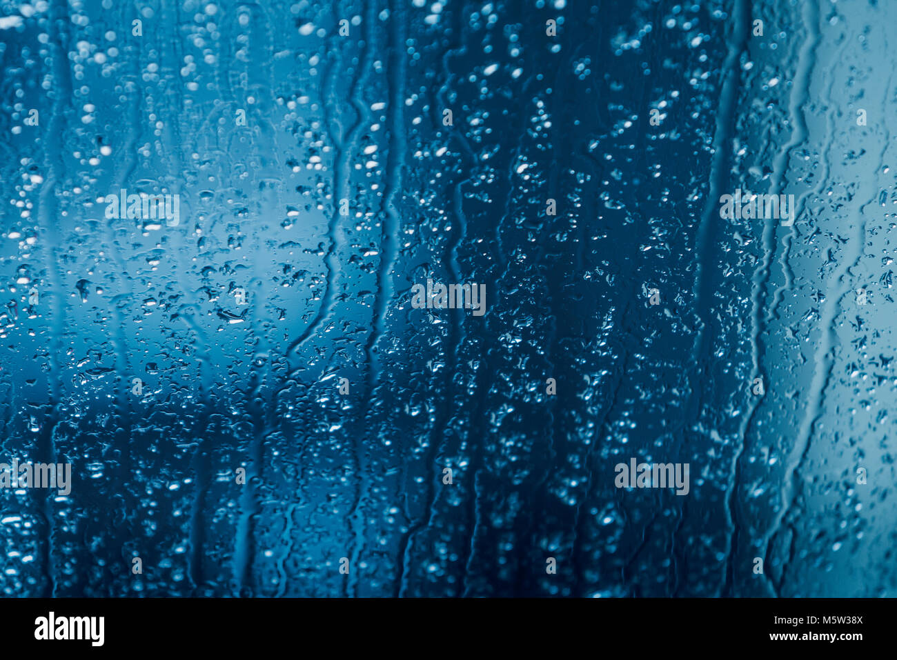 water drops of rain on a window glass. Rainy day Stock Photo - Alamy