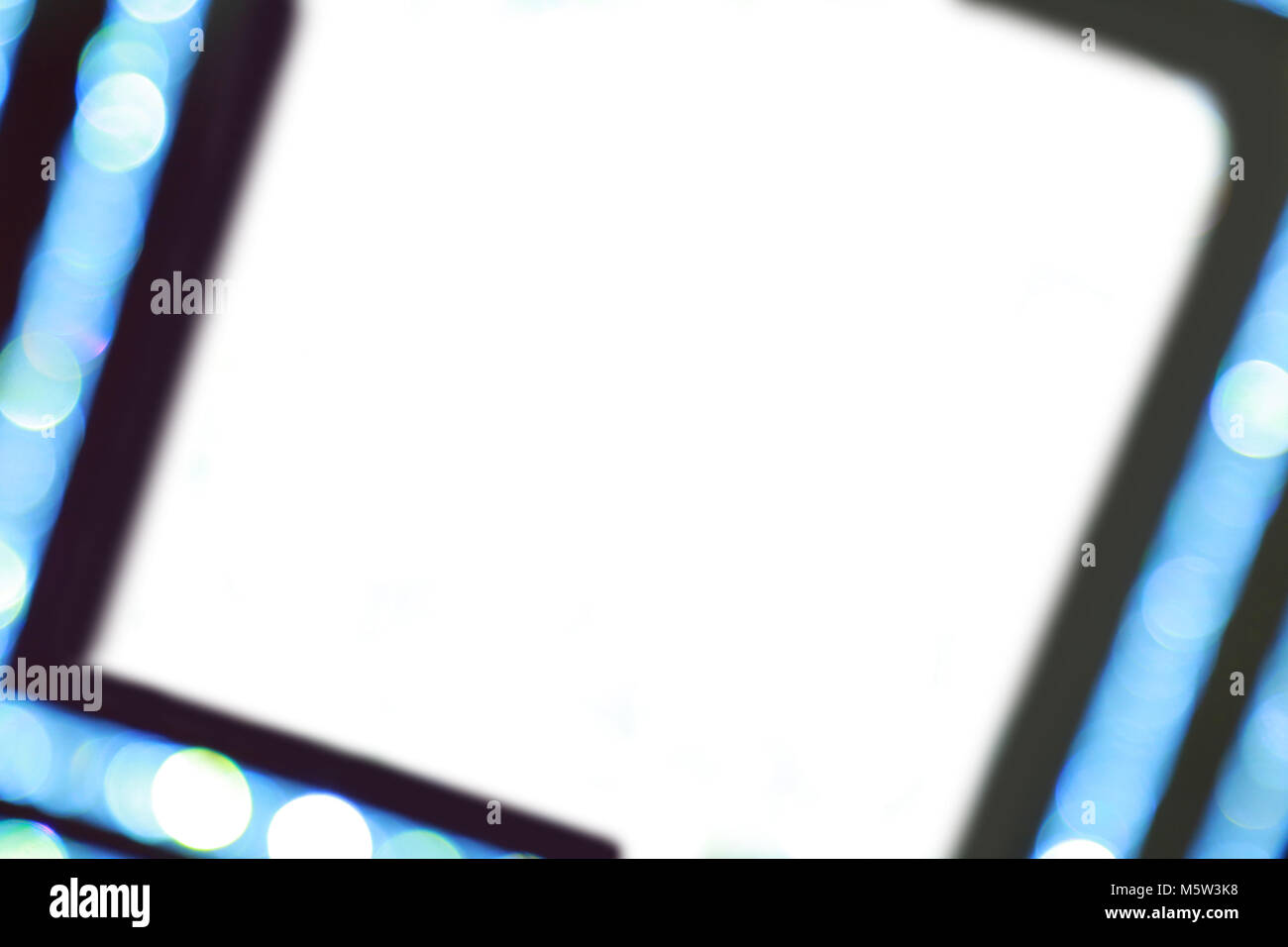 Abstract blue light blurry frame with white background Stock Photo - Alamy