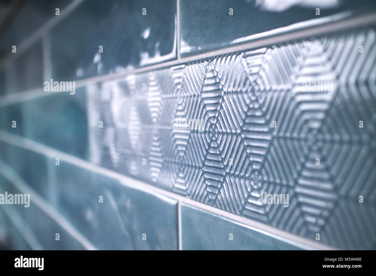 Close-up of a glossy ceramic blue tile with a pattern Stock Photo - Alamy