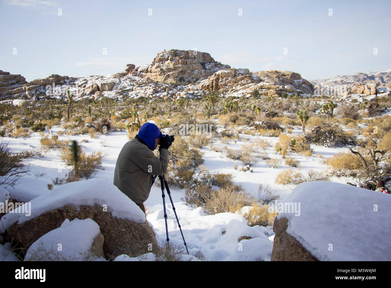 Snowfall on - Photographer on Barker Dam trail Stock Photo - Alamy